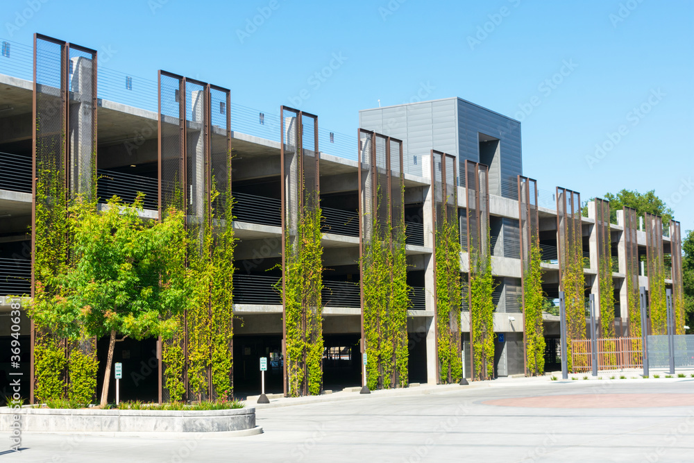 Multi level modern parking garage facade and exterior. Green living plant wall. Stock Photo ...