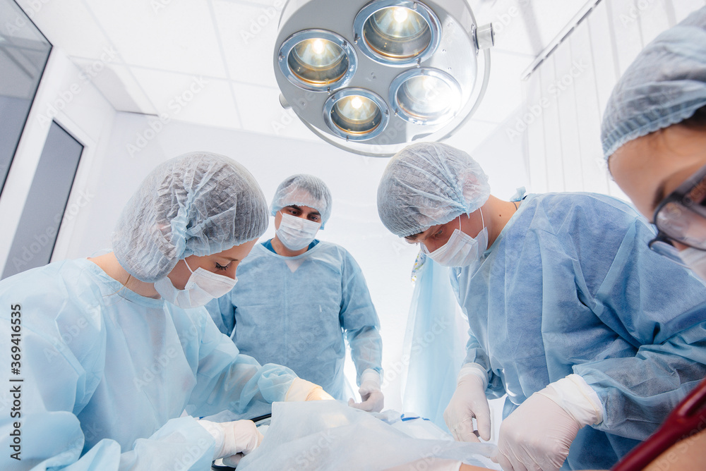 Operation in a modern operating room close-up, emergency rescue and ...