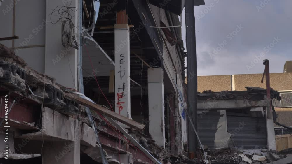 Walls on a Mall being demolished with various types of rubble, shot can ...