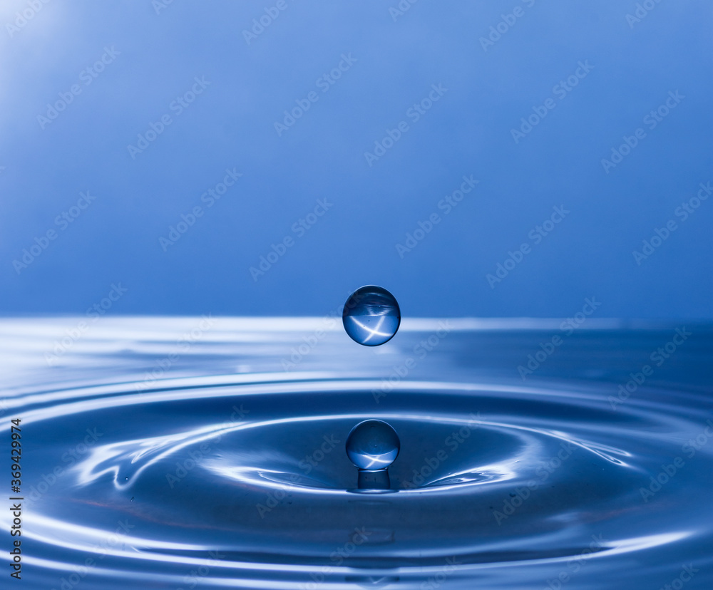 Water Drop Collisions Macro Photography with blue background Stock ...