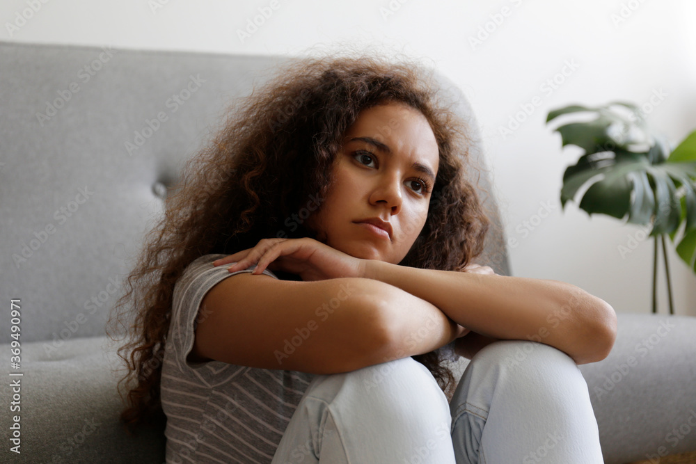 Portrait of young beautiful black woman with depressed facial ...