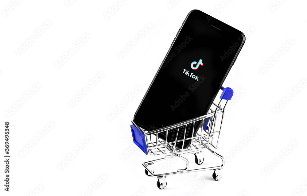 shopping cart with TikTok logo on the screen smartphone on white ...