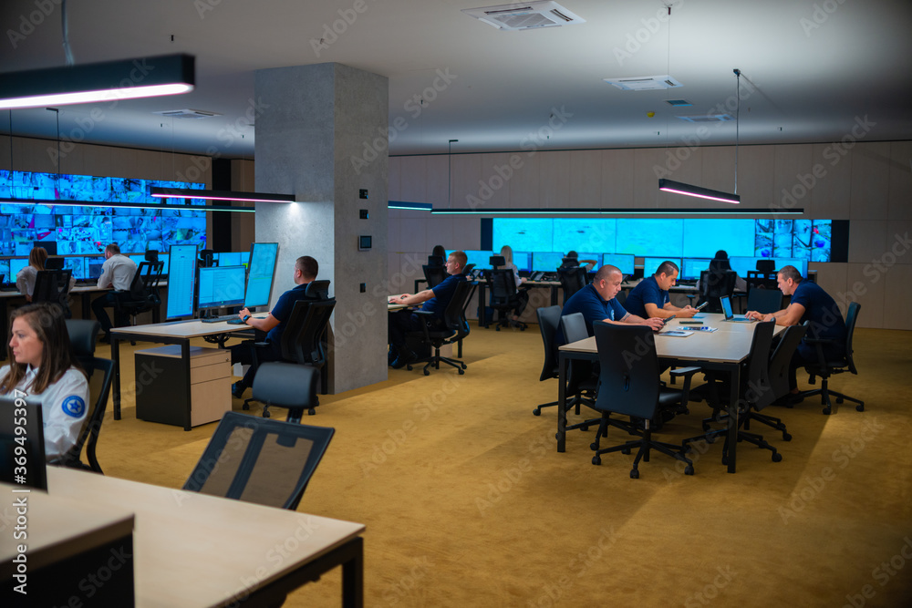 Group of Security data center operators (administrators) working in a ...