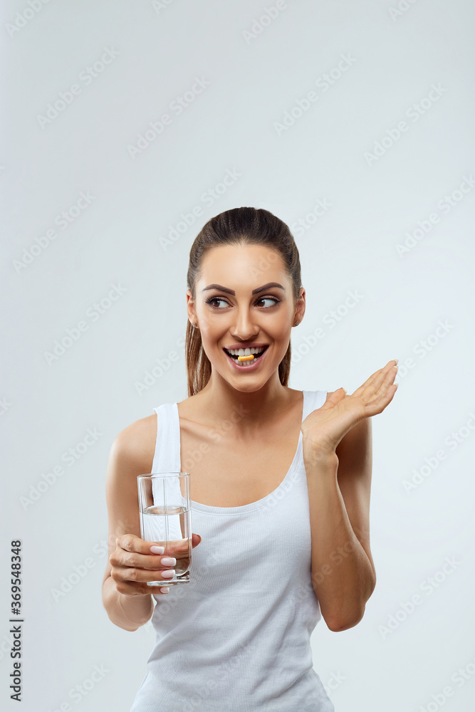 Beautiful Woman Opened Mouth Holding Vitamin Pill In White Teeth ...