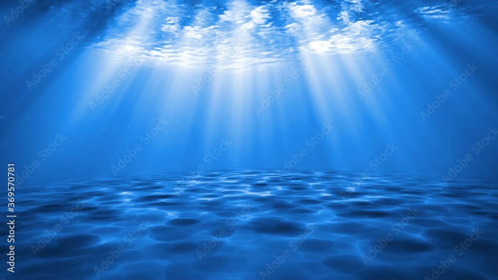 Underwater view with ocean waves flowing in the clear blue water ...