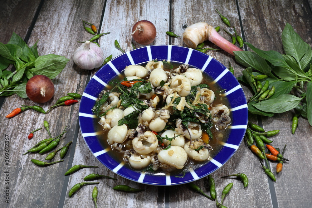 Traditional fried and stirred fresh cuttlefish (squid) with chopped ...