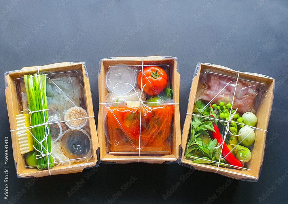 Top view of food ingredients in boxes on back background. They are pre ...