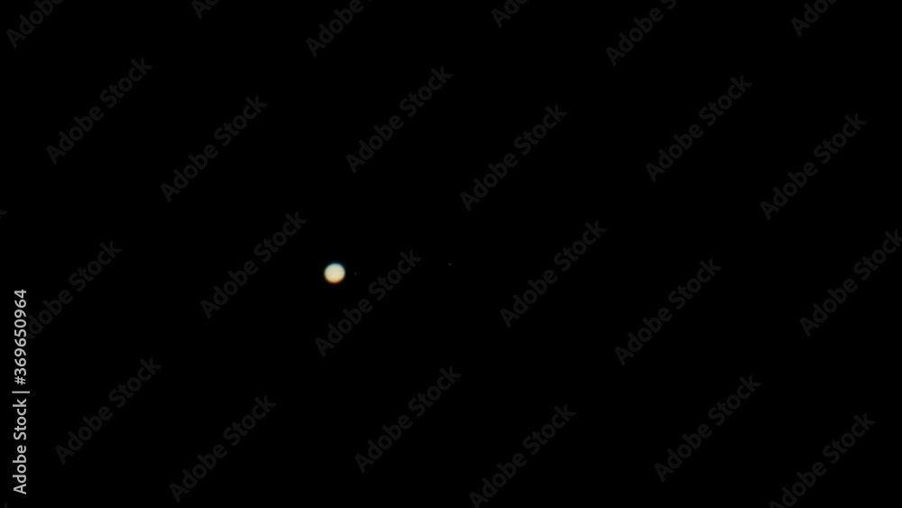 Jupiter as seen in backyard telescope large magnification with four ...