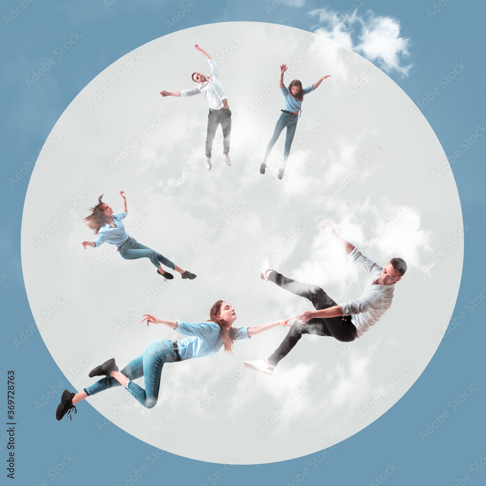 Mid-air beauty cought in clouds. Full length shot of attractive young ...