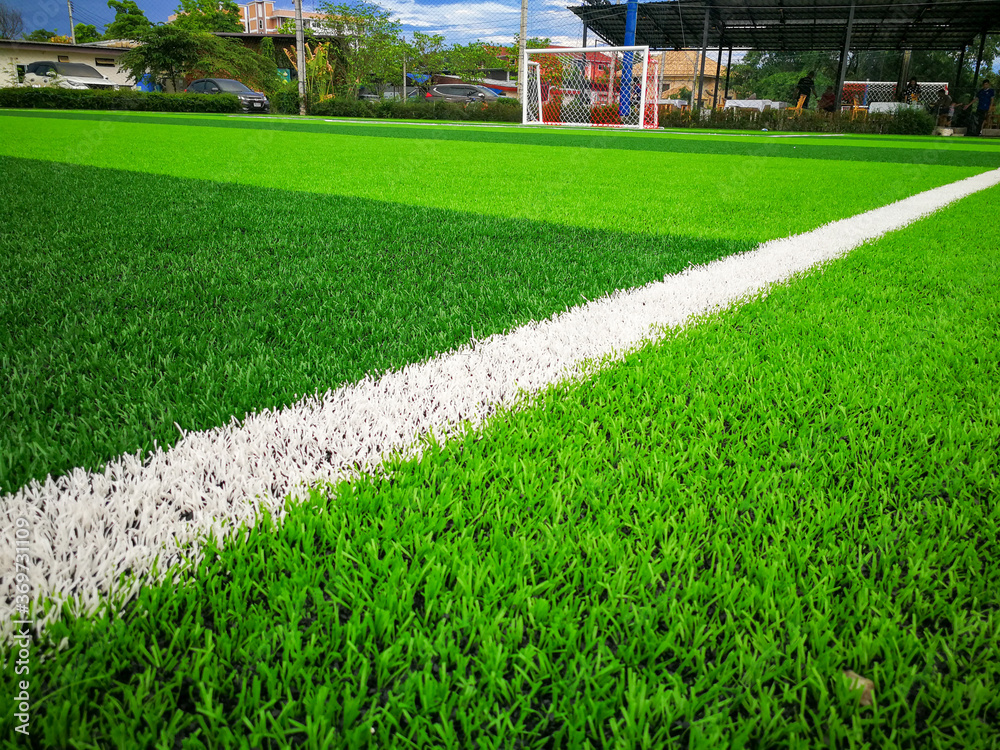 Football field, astro turf surface. Close up of throw in, kick off and ...