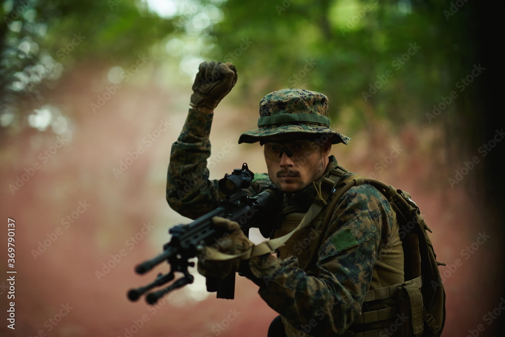 officer is showing tactical hand signals Stock Photo | Adobe Stock