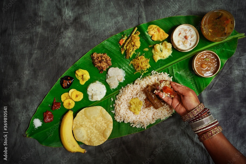 Kerala Onam Feast / Eating Ona-Sadya in banana leaf during the festival ...
