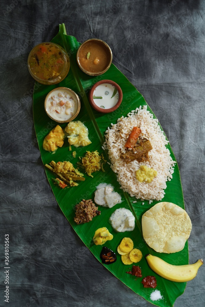 Onam feast / Kerala Ona-sadya served in banana leaf Stock Photo | Adobe ...