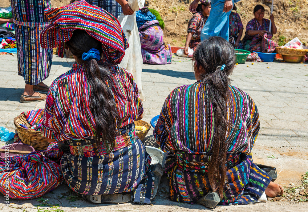 Poster Indigenous maya women with colorful mayan clothing on a local ...
