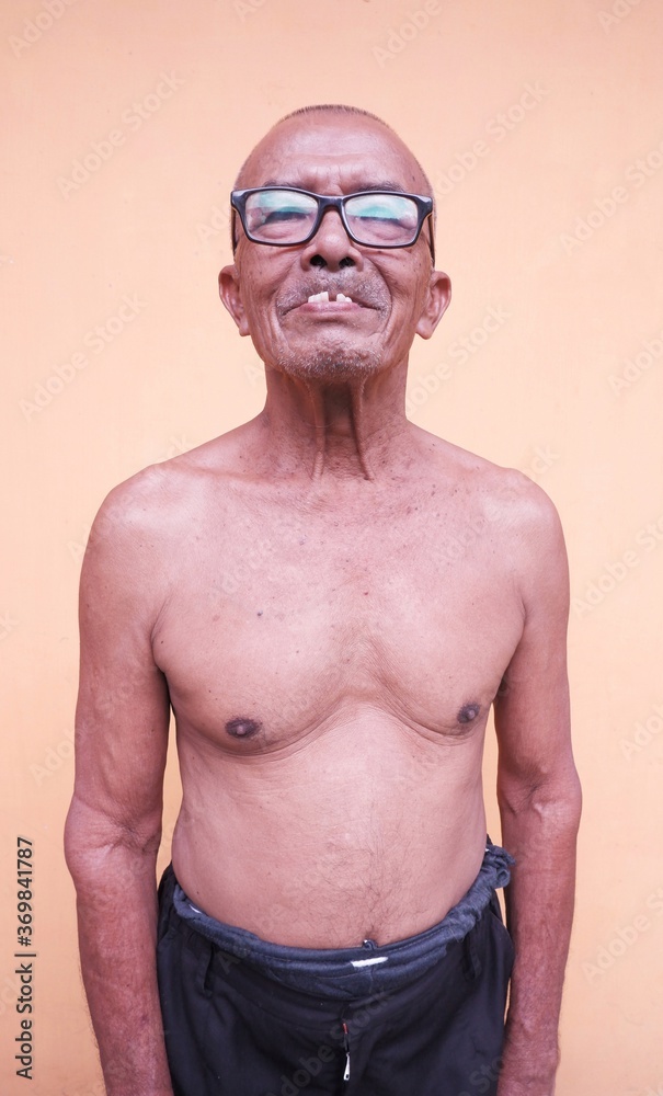 portrait of a asian senior man shirtless and wearing glasses Stock ...