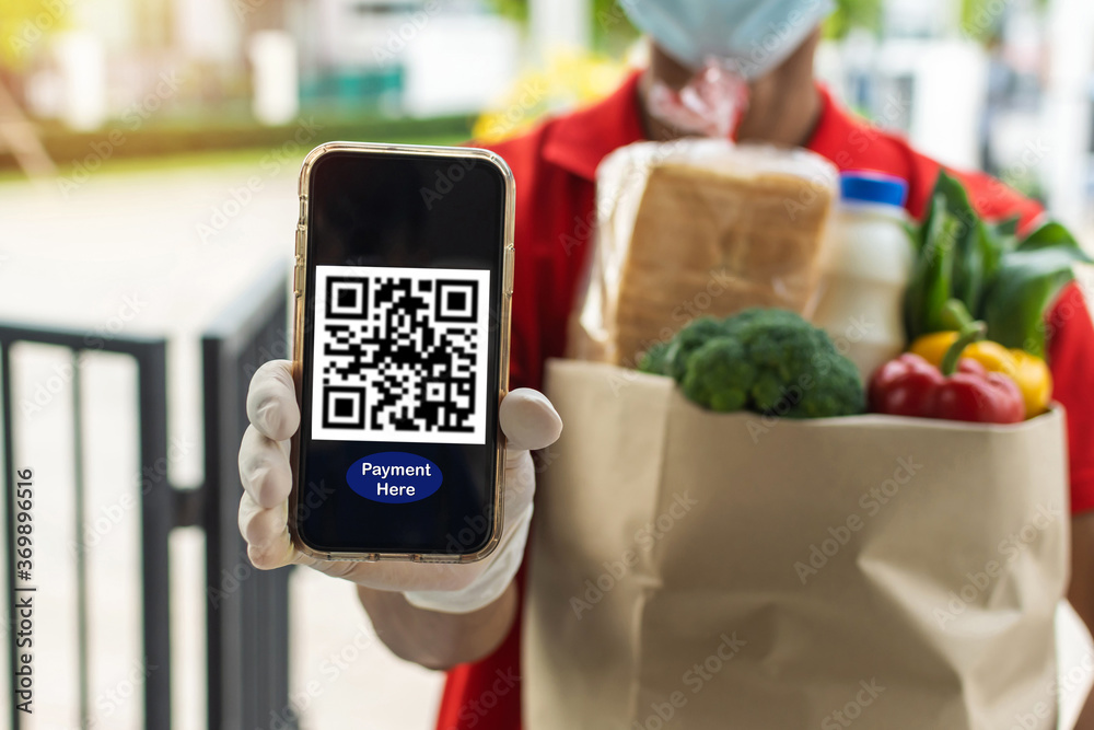 food delivery service man hand showing QR code on digital mobile phone ...