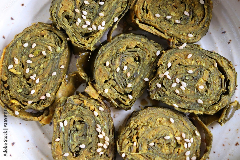 Alu Vadi or Patra or colocasia leaves roll is a popular Indian steamed ...