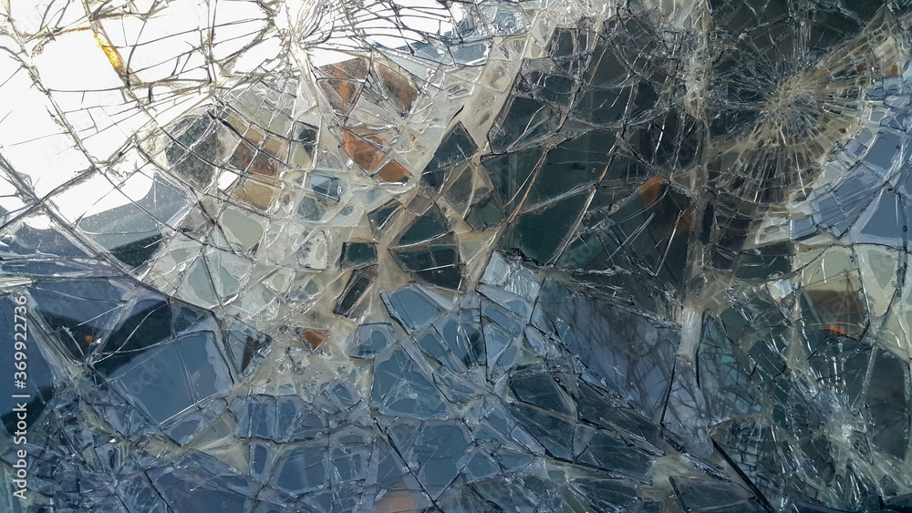 The broken windshield of the car. Glass splinter. An accident with the ...