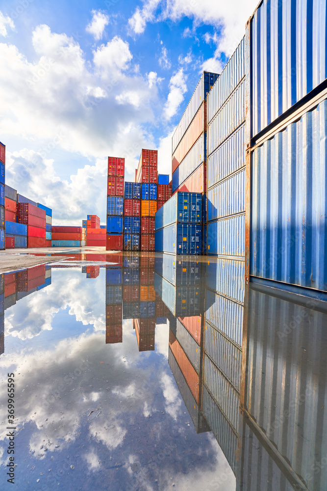 box container cargo site stacking and mirror on water with blue sky ...