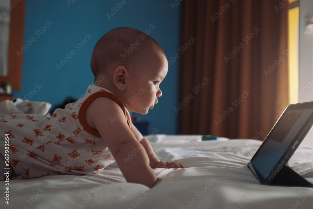 Baby watching cartoons Stock Photo | Adobe Stock