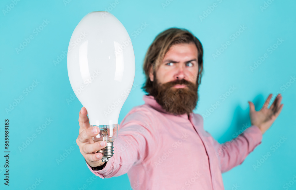 bearded thinking man hold bulb. Energy saving. innovative idea and ...