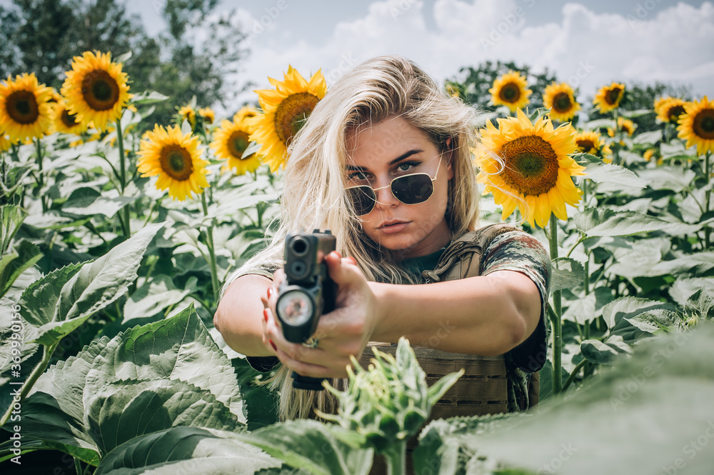 Beautiful and attractive woman soldier with rifle machine gun. Front ...