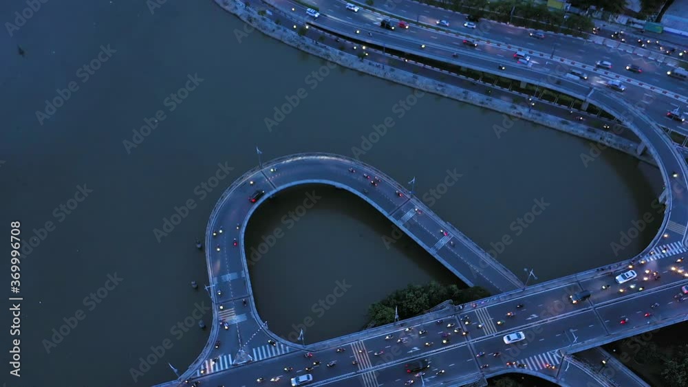 tilting down drone shot of Nguyen Van Cu bridge, motorway and ...