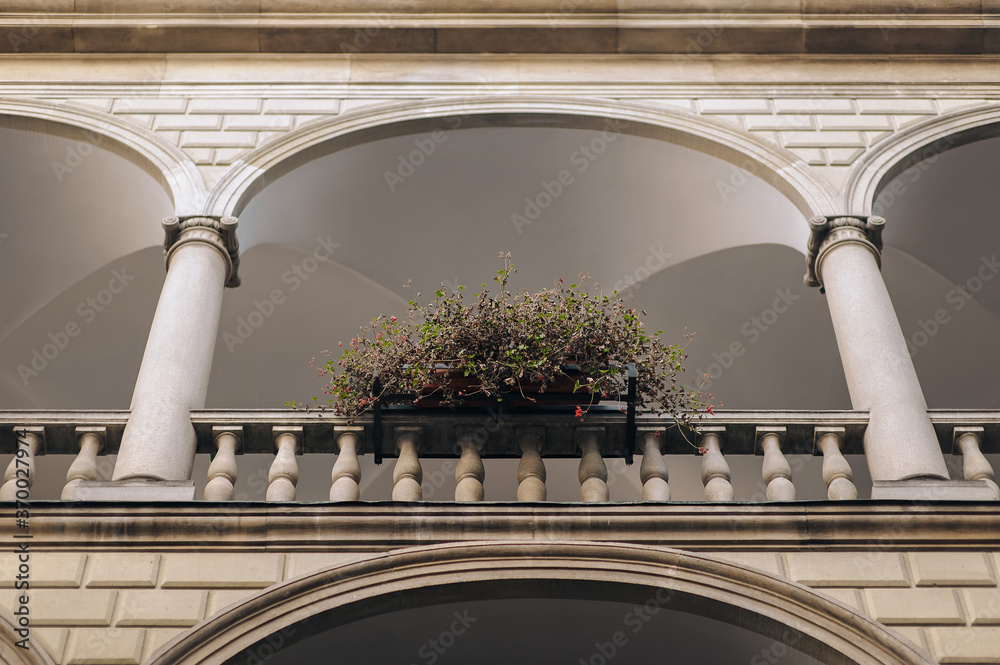 Old arched balcony, baroque style with columns and balustrade and ...