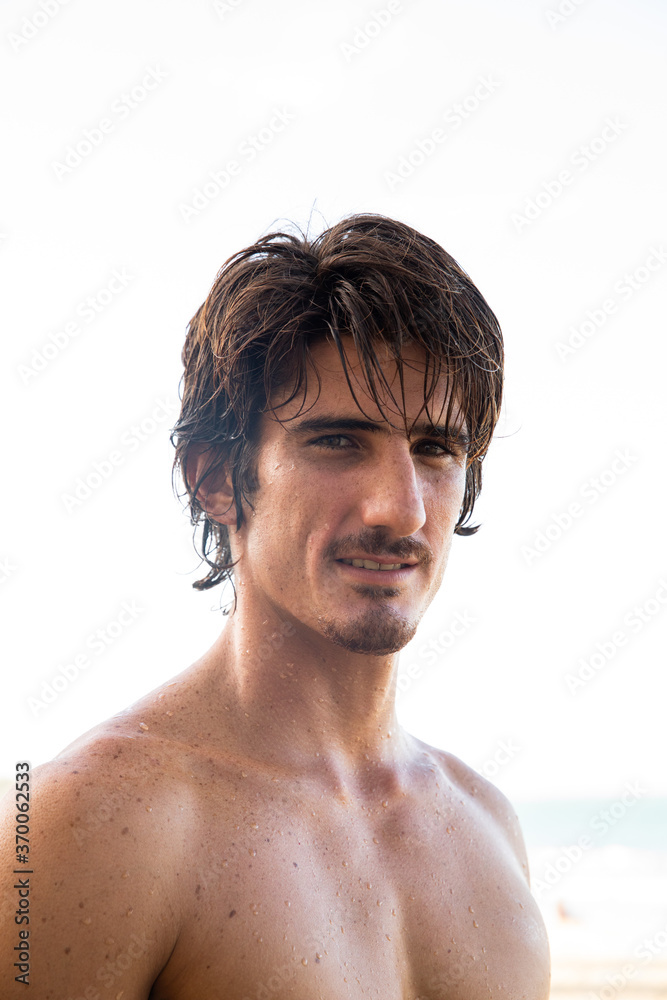 Portraits of surfer at the beach. Stock Photo | Adobe Stock