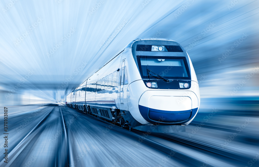 High speed train runs on rail tracks . Train in motion Stock Photo ...
