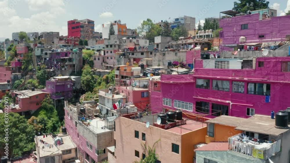 Vidéo Stock Drone is flying along colorful slum suburban district in ...
