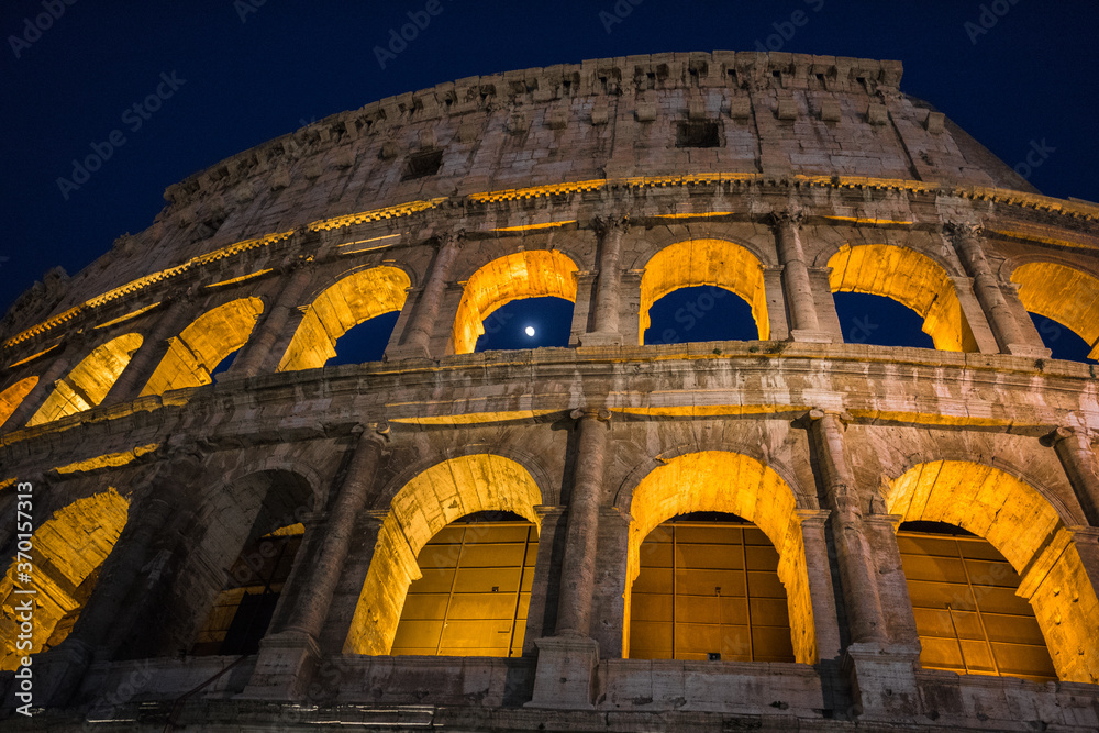 The monumental Colosseum at night, the largest oval Amphitheatre built ...