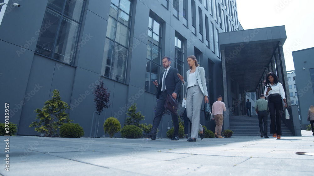 Urban busy corporate workers walking on street in downtown. Multi ...