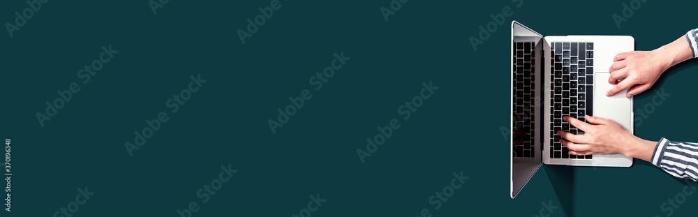 Person using a laptop computer from above Stock Photo | Adobe Stock
