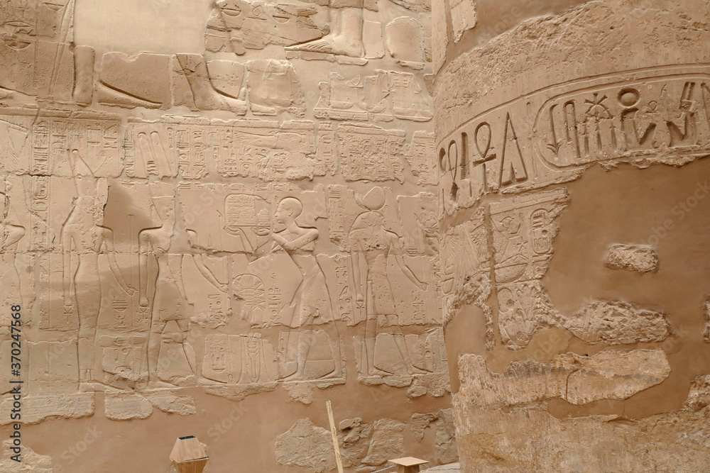 Hieroglyphics on the massive columns of the hypostyle Stock Photo ...