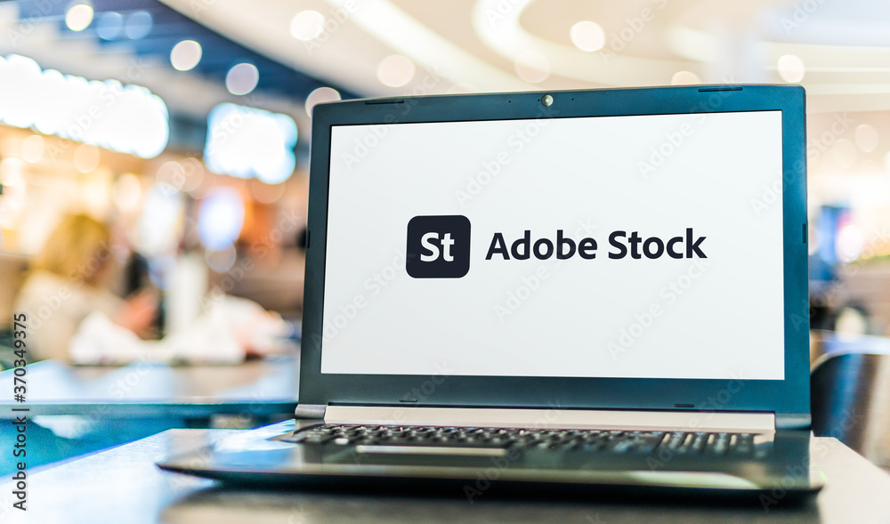 Laptop computer displaying logo of Adobe Stock Stock Photo | Adobe Stock