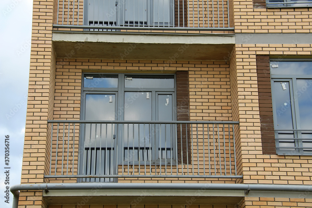 Window on background of brick wall of residential building. Insulated ...