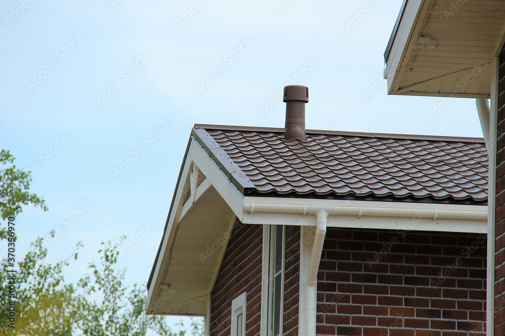 icon roof with new brown roofing tiles on residential property. banner ...
