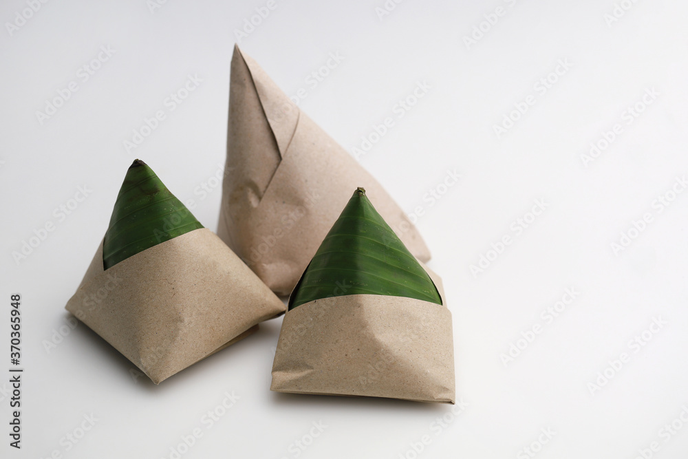 Nasi lemak wrapped with banana leaf isolated on white background. Nasi ...