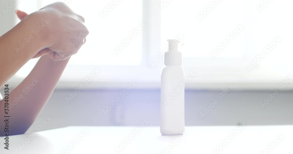 Female hands body part treating sanitizing with lotion gel, health ...