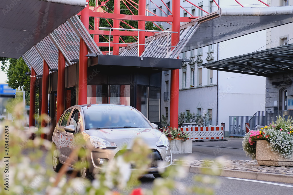 BASEL, SWITZERLAND, SAINT-LOUIS, FRANCE, JULY 2020: the car crosses the ...