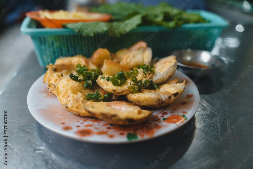 Vietnamese street food "banh can" make by rice powder with rice flour ...