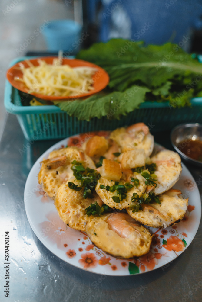 Vietnamese street food "banh can" make by rice powder with rice flour ...