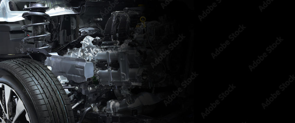 The powerful engine of a car on black background,free space on right ...