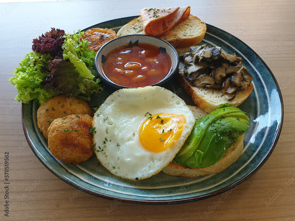 Big breakfast or brunch set, toasted bread served with butter mushroom ...