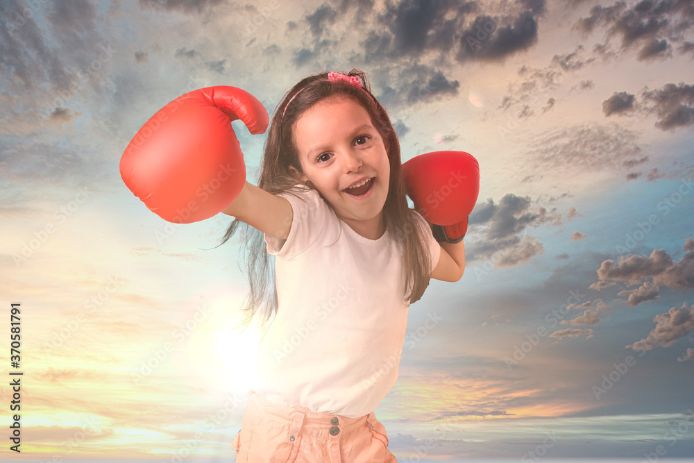 Cute little girl in boxing gloves Stock Photo | Adobe Stock