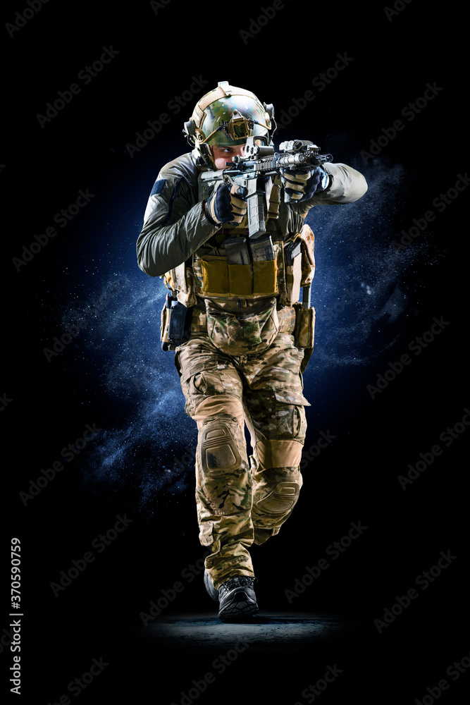 Army soldier in Protective Combat Uniform holding Special Operations ...