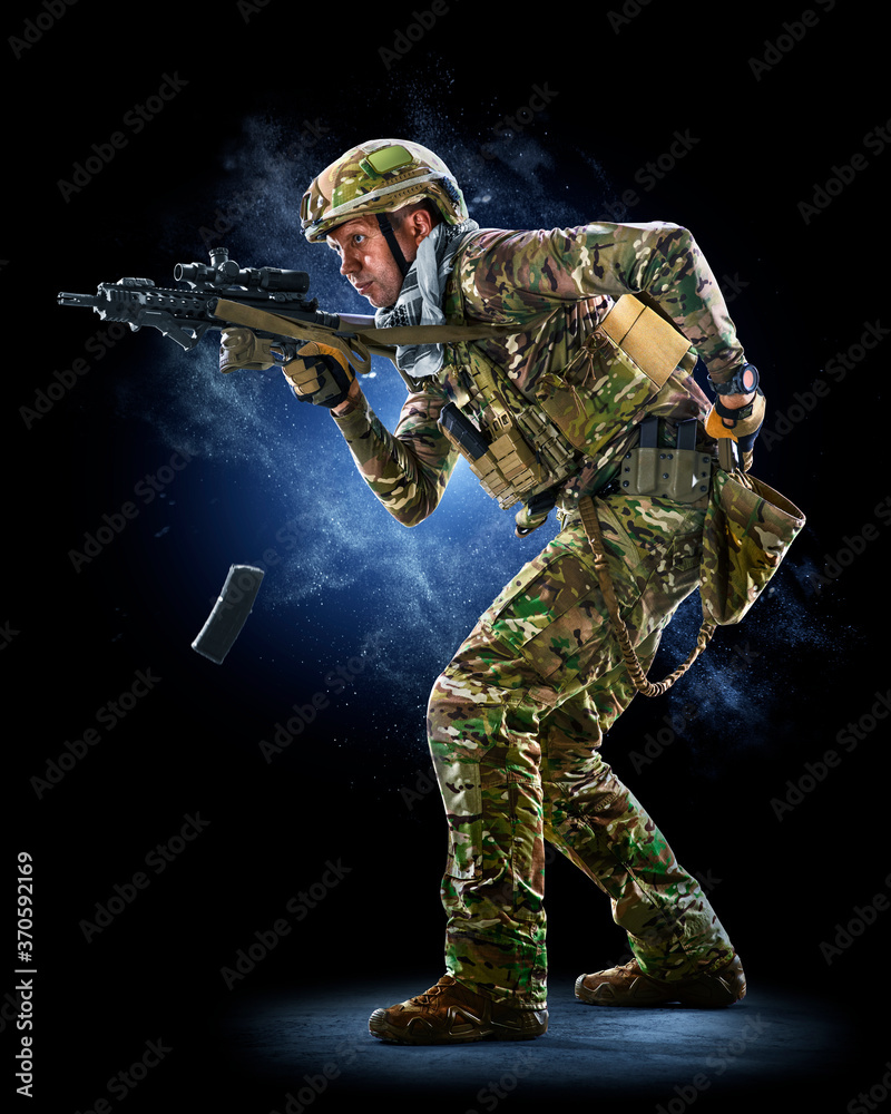 Army soldier in Protective Combat Uniform holding Special Operations ...
