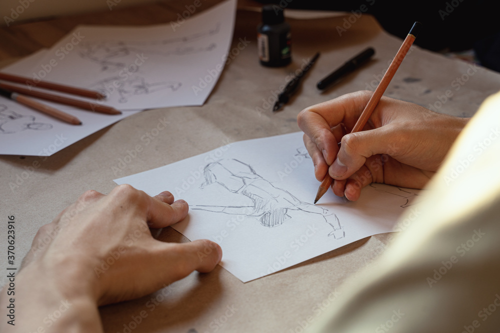 Drawing, sketching the human figure with a pencil Stock Photo | Adobe Stock