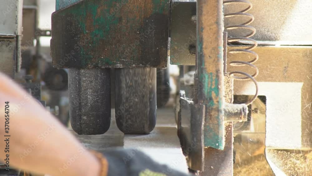 Sawing machine at wood production factory. Timber material processing ...